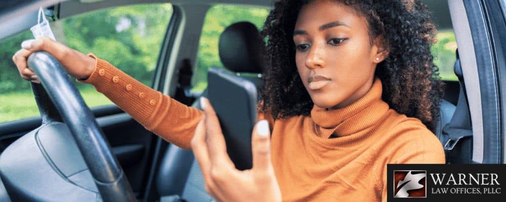 Protect your rights after a distracted driving car accident | Warner ...